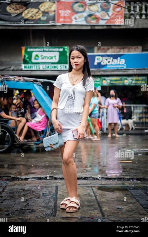 A Beautiful Young Filipino Girl Poses In The Binondo District Of Manila