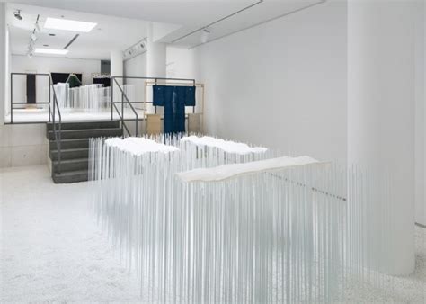 Hemp Textiles Are Laid Across Metal Rods In Japanese Exhibition