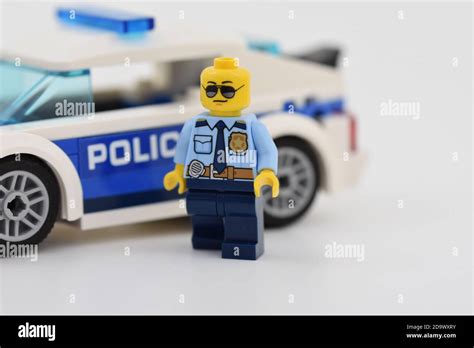 A Policeman Mini Lego Figure Stood Next To His Police Car On A White Background Stock Photo Alamy