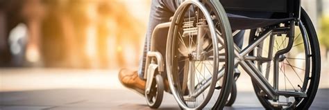 Premium Ai Image Man In Wheelchair Outdoor Highlighting The Theme Of