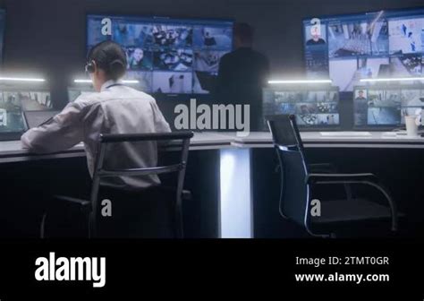 Multi Ethnic Security Employees Monitor Cctv Cameras In Police
