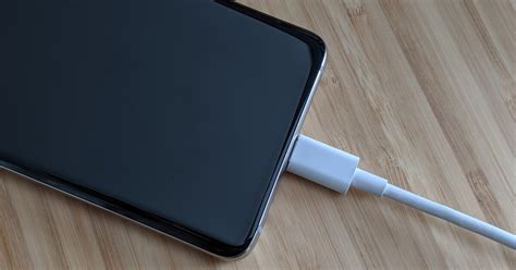 automatic charger that ejects from phone using arduino motors