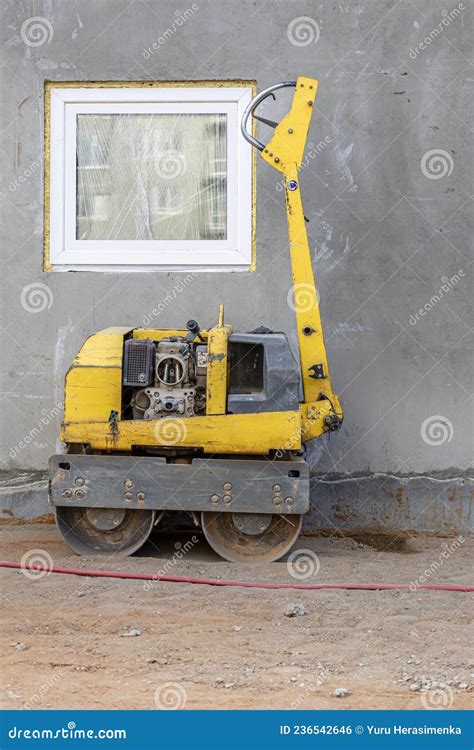 Manual Compact Asphalt Roller For Tamping Soil At A Construction Site