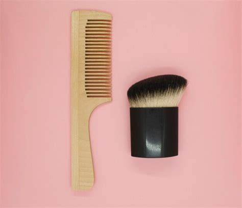 Premium Photo Wooden Comb And Cosmetic Brush