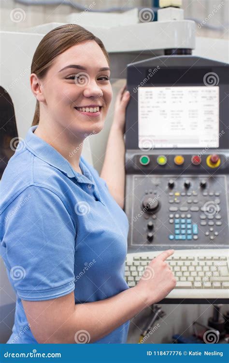 Portrait Of Female Apprentice Engineer Operating CNC Machine In Stock Photo Image Of Factory