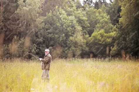 Premium Photo A Man Walks Across The Field Into The Forest For Mushrooms The Mushroom Picker