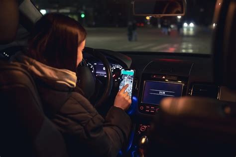 Premium Photo Driving A Car At Night A Woman Driving Her Modern Car At Night In The City