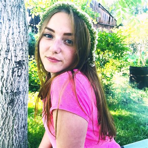 Premium Photo Portrait Of Woman Against Tree Trunk