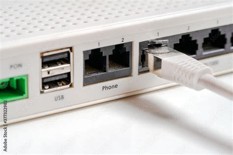 Internet Cable Connected To LAN Port Socket Of Router Stock Photo Adobe Stock