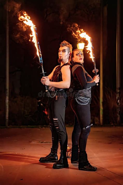 Fire Dancers Performing With Torches At Night Creating A Spectacular Show Stock Image Image
