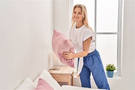Young Blonde Woman Standing Doing Bed At Bedroom Stock Image Image Of