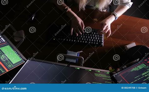 Female Hands Typing Computer Code Hacking Computer At A Dark Room