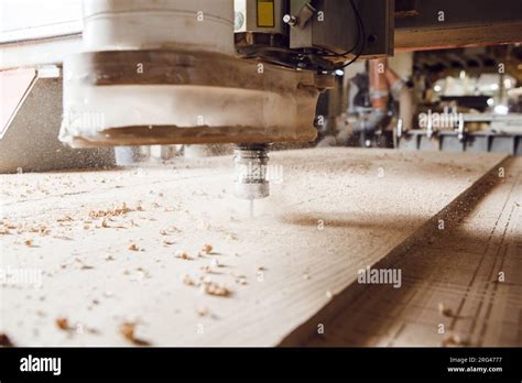 Cnc Machine At Carpentry Workshop Cutting Wood With Various Router