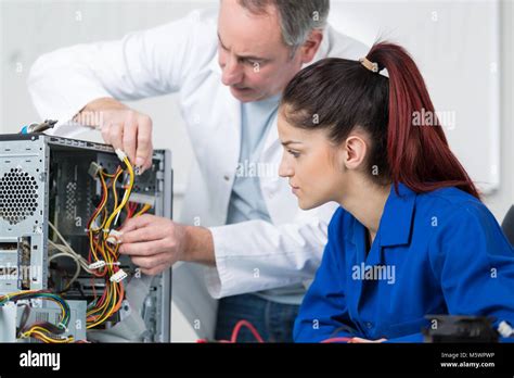 Female Babes Fixing A Laptop Stock Photo Alamy