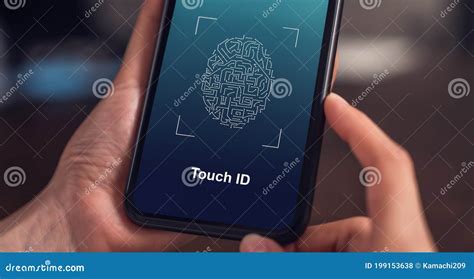 Close Up Of Hands Scanning Fingerprint On Smartphone To Unlock Mobile Phone On The Table