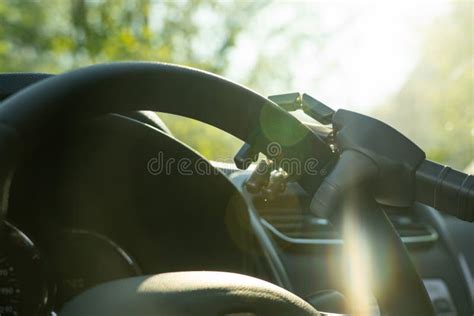 Robot Arm On A Steering Wheel Artificial Intelligence Drives A Car Autonomous Vehicle Concept Robot Arm On A Steering Wheel Artificial Intelligence Drives A Car Autonomous Vehicle Concept