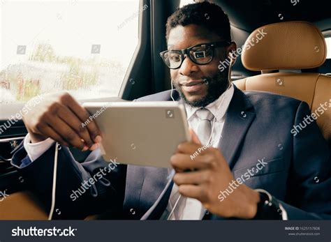 Man Scrolling Through Tablet Screen During Stock Photo Shutterstock