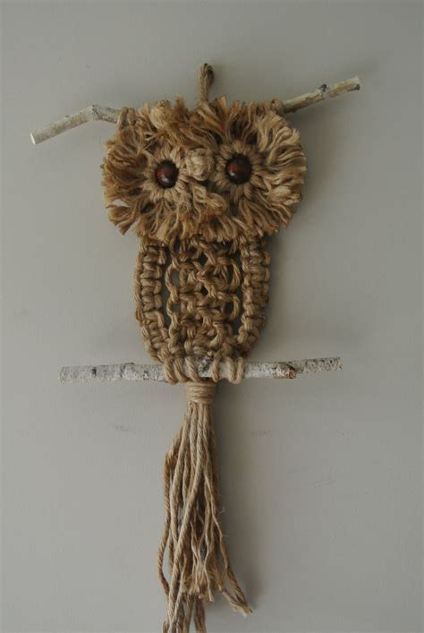 An Owl Made Out Of Rope Hanging On A Wall