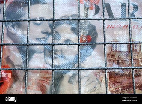 Poster Of A Couple Behind Grid Paris Île De France France Stock