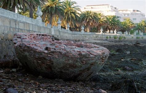 Premium Photo Concrete Structure Next To Sea Promenade At Low Tide