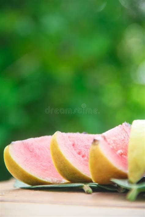 Fresh Ripe Guava And Sliced Sliced Guava On Wooden Table With Natural