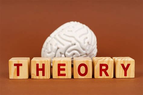 Exploring The Intricacies Of Brain Theory With Wooden Blocks Against A Soft Brown Background