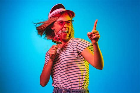 Beautiful Woman In Neon Light On Blue Studio Background Stock Photo Image Of Party Retro