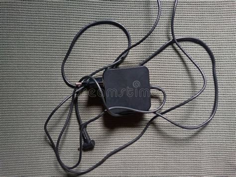 Laptop Charger With Its Messy Cable On A Structured Surface Stock Image Image Of Cablewire