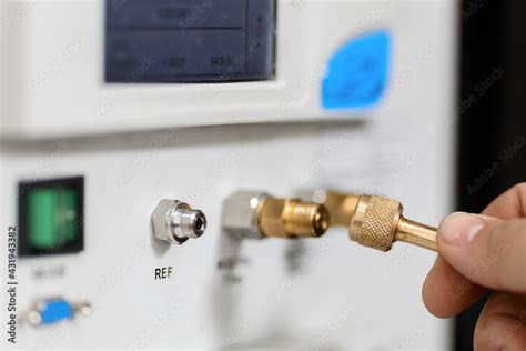 The Metrology And Standardization Laboratory Specialist Connects The Device Under Test Pressure