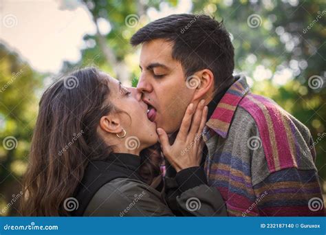 People French Kissing On The Lips