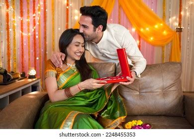 Romantic Indian Husband Surprising His Wife Stock Photo