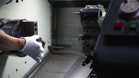 Cnc Lathe Operator The Workpiece In The Chuck Is Being Removed Stock Video Video Of Hole