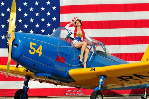 Patriotic American Pin Up Girl Tipping Her Hat While Posing With A Pt