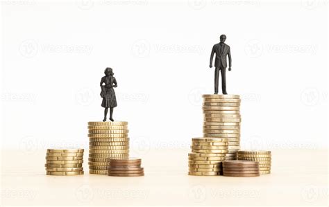 Gender Wage Gap Concept Man And Woman Figurines Standing On Top Of The