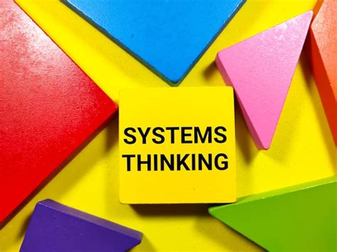Premium Photo Business Concepttext Systems Thinking Writing On Colored Tangram On A Yellow