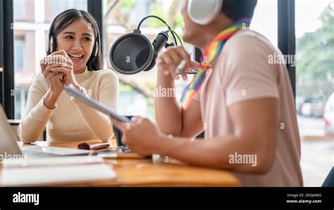A Beautiful Asian Female Podcast Radio Host Enjoys Talking With Her Gay Colleague While