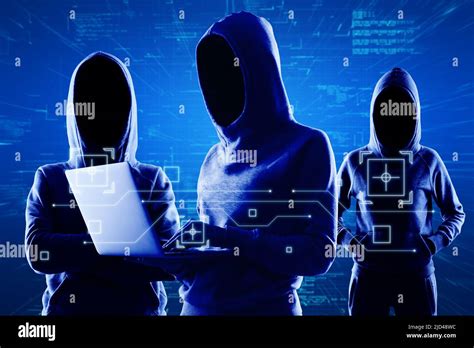 Cyber Protection And Internet System Hacking Concept With Blue Shadows Faceless Hackers In Hoody