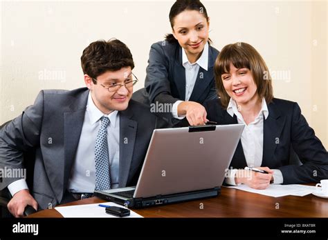 Business Woman Is Explaining The Correct Way Of Analysis To Her Colleagues In The Office Stock