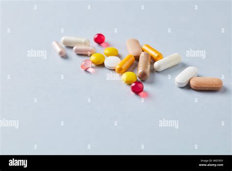 Vitamins And Supplements On Bright Paper Background Concept For A