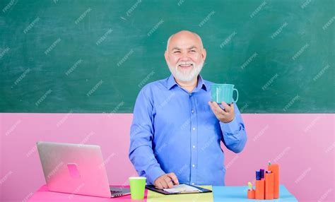 premium photo school teacher programming with laptop programming web