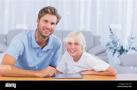 Father Son Using Touchscreen Tablet Hi Res Stock Photography And Images Alamy
