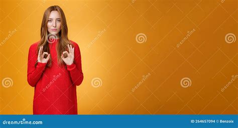 Calm And Confident Girl Showing Self Assurance And Professionalism As Making Okay Gesture With