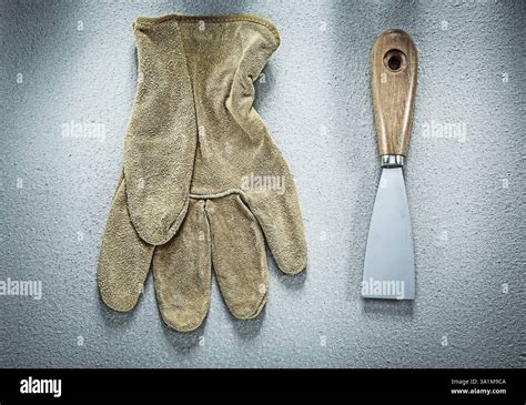 Putty Knife Safety Gloves On Concrete Background Construction Concept
