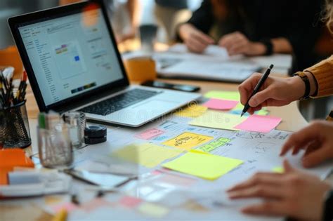 Engaging Team Collaboration On Digital Project With Sticky Notes And Laptop At Modern Workspace