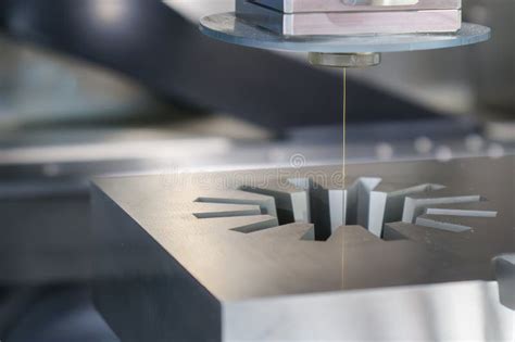 The Die Insert Gear Shape Cutting Process By Wire Edm Machine Control By Cnc Program Stock Image