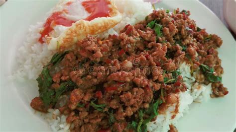 Rice Topped With Stir Fried Pork And Basil And A Fried Egg Stock