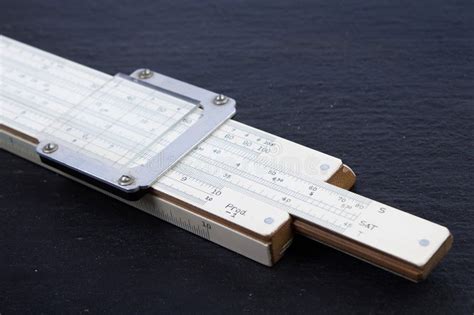 Logarithmic Ruler On Black Background Stationery For Engineers And