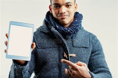 A Man Shows The Empty Screen For Your Copyspace On His Tablet W Stock