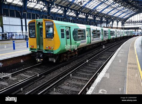 A Class 313 Passenger Train In Brighton Station Inside The Canopy Stock