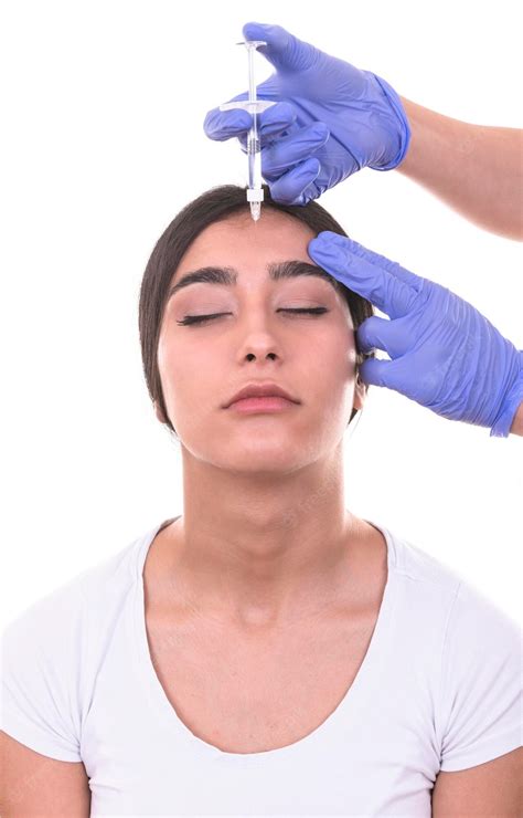Premium Photo Young Woman Gets Injection Of Botox In Her Lips Woman In Beauty Salon Plastic